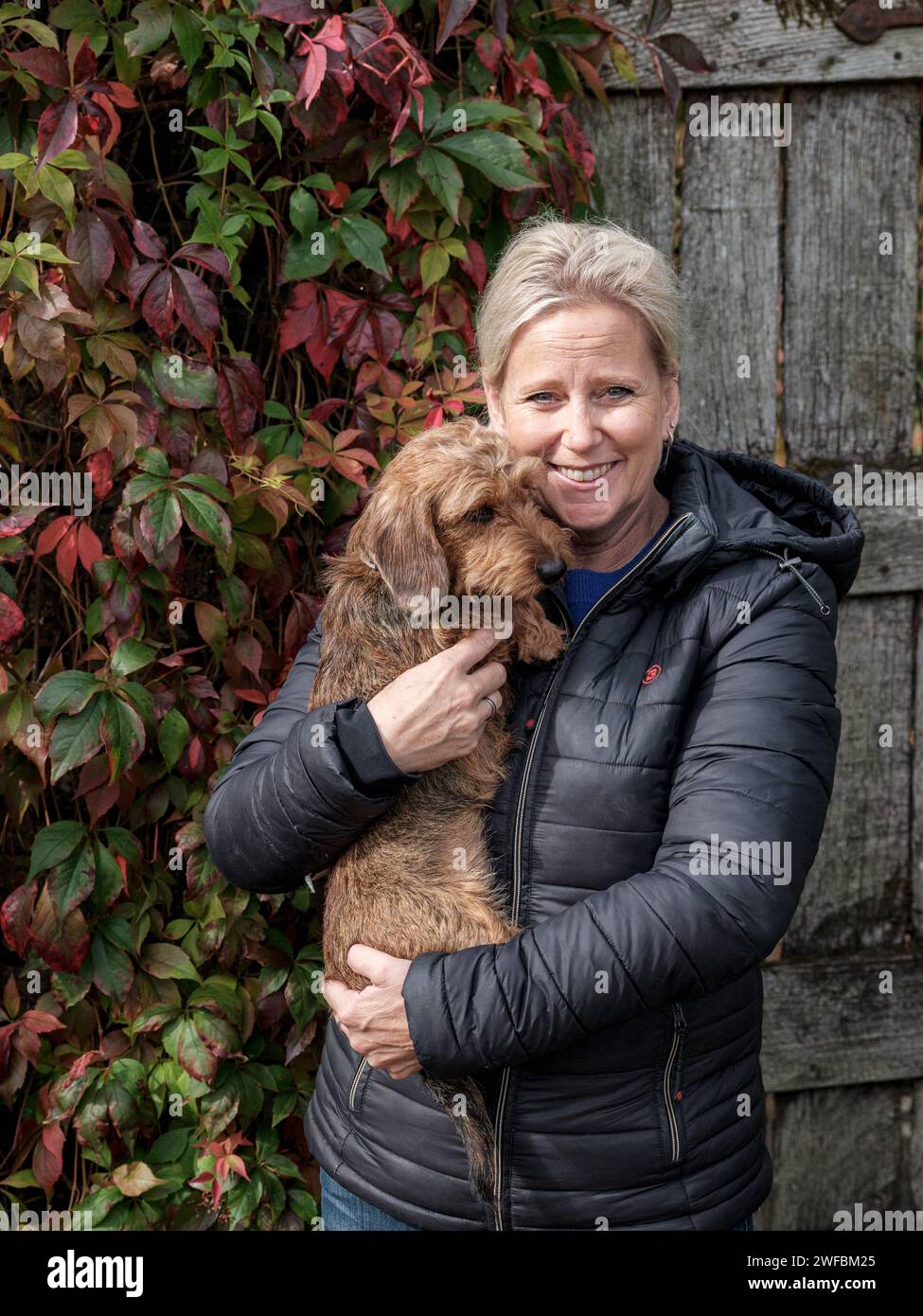Charlie Henson at home with her dog Stock Photo - Alamy