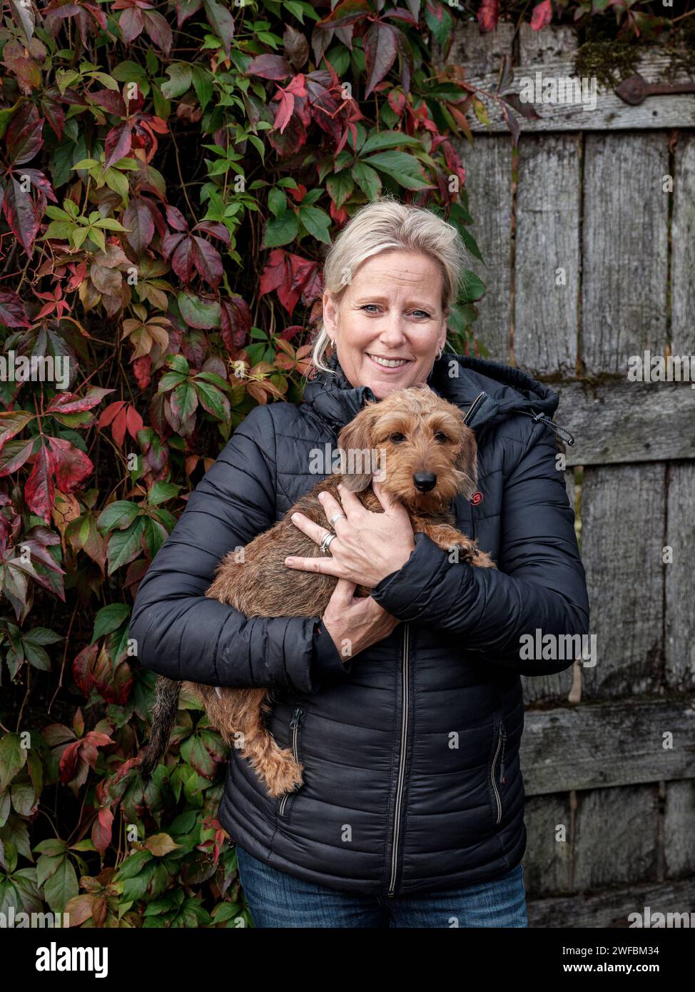 Charlie Henson at home with her dog Stock Photo - Alamy