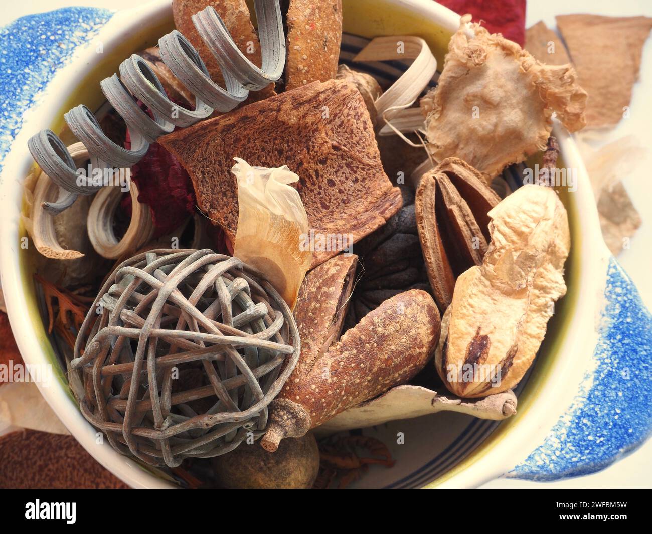A pot-pourri arrangement derived from dried naturally fragrant plant ...
