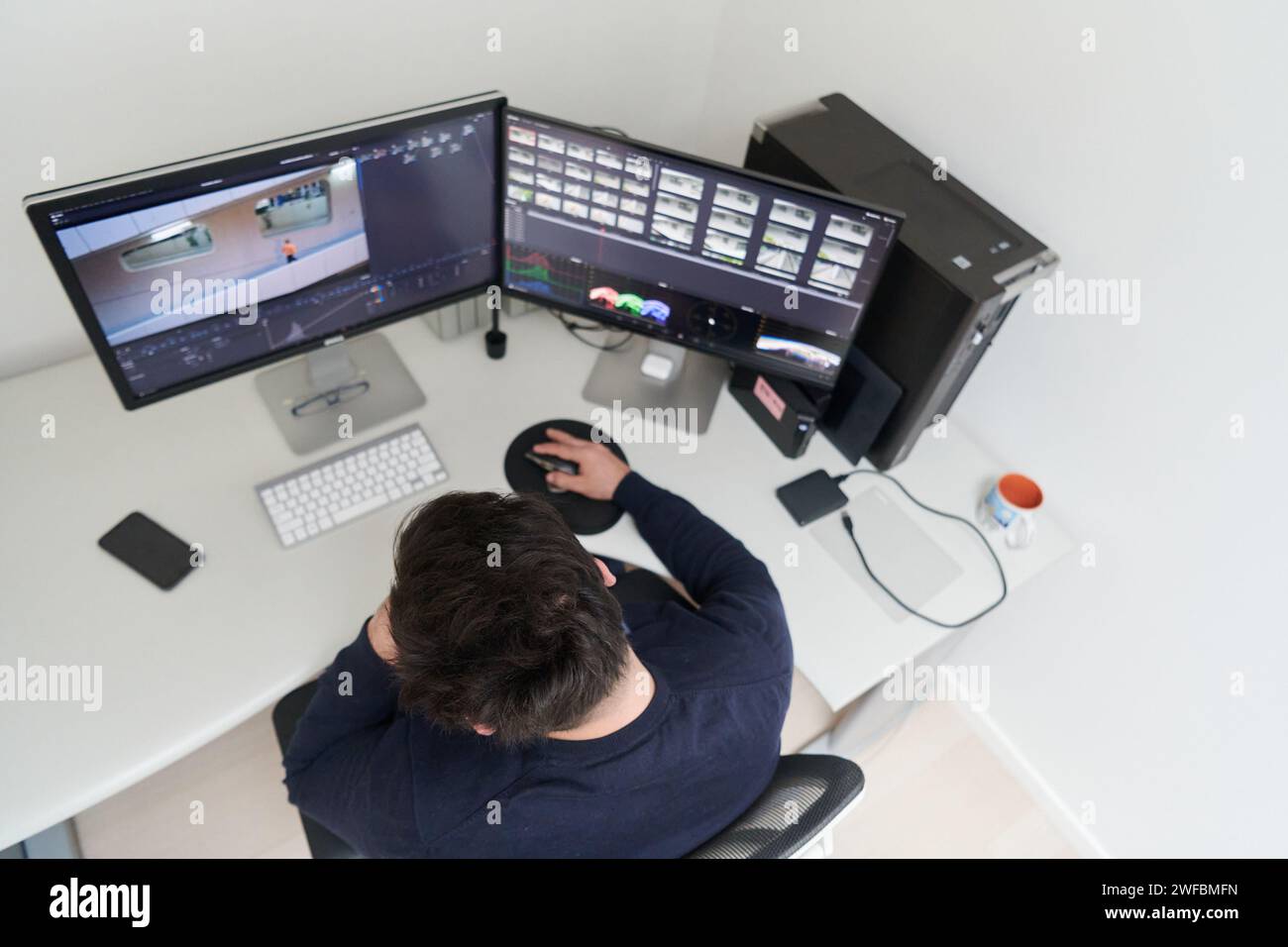 professional video editor enhancing digital footage using specialized ...