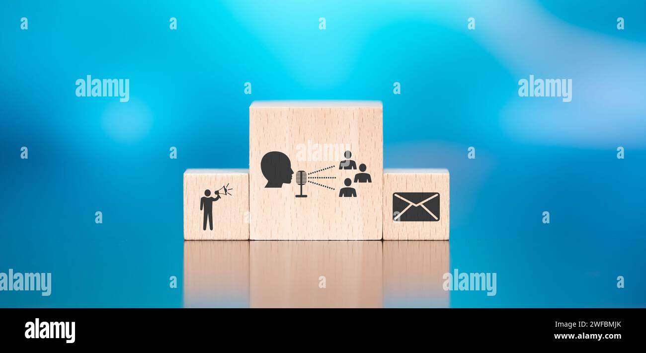 Wooden blocks with symbol of public relations concept on blue ...