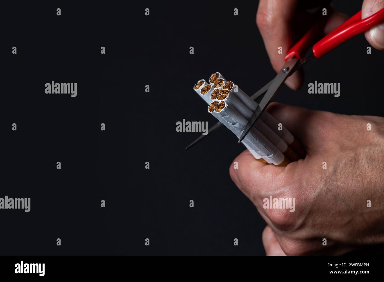 Quit smoking. Closeup of man hands holding bunch of cigarettes and ...