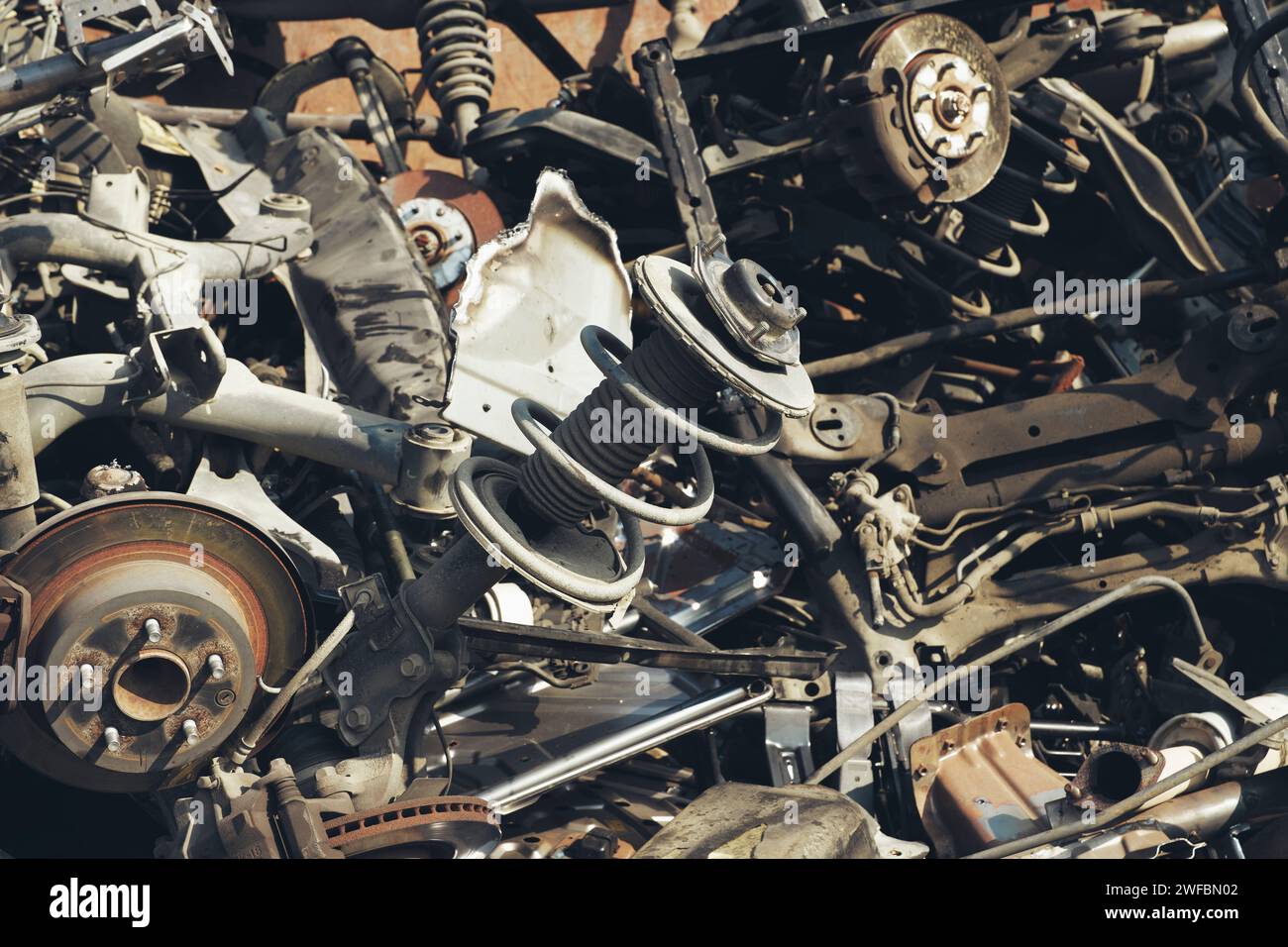Suspension laid out as scrap metal at a junkyard Stock Photo - Alamy