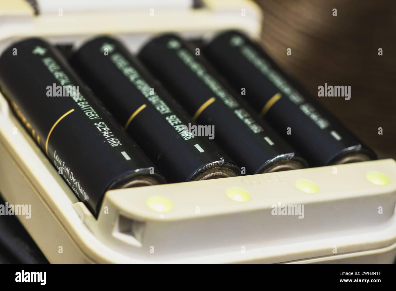 finger batteries AA are charged in the charger Stock Photo - Alamy