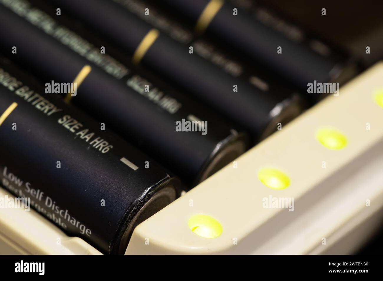 finger batteries AA are charged in the charger Stock Photo - Alamy