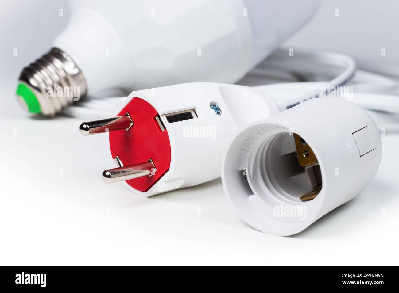 Electric European plug and lamp holder light bulb. White power cable ...