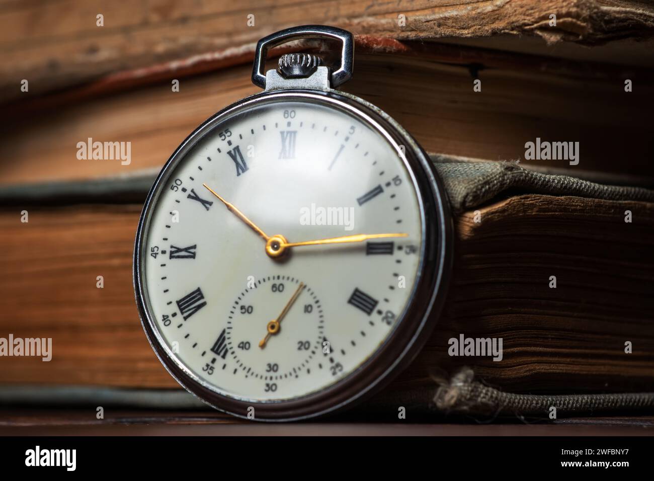 Old vintage watch on books background close up Stock Photo - Alamy