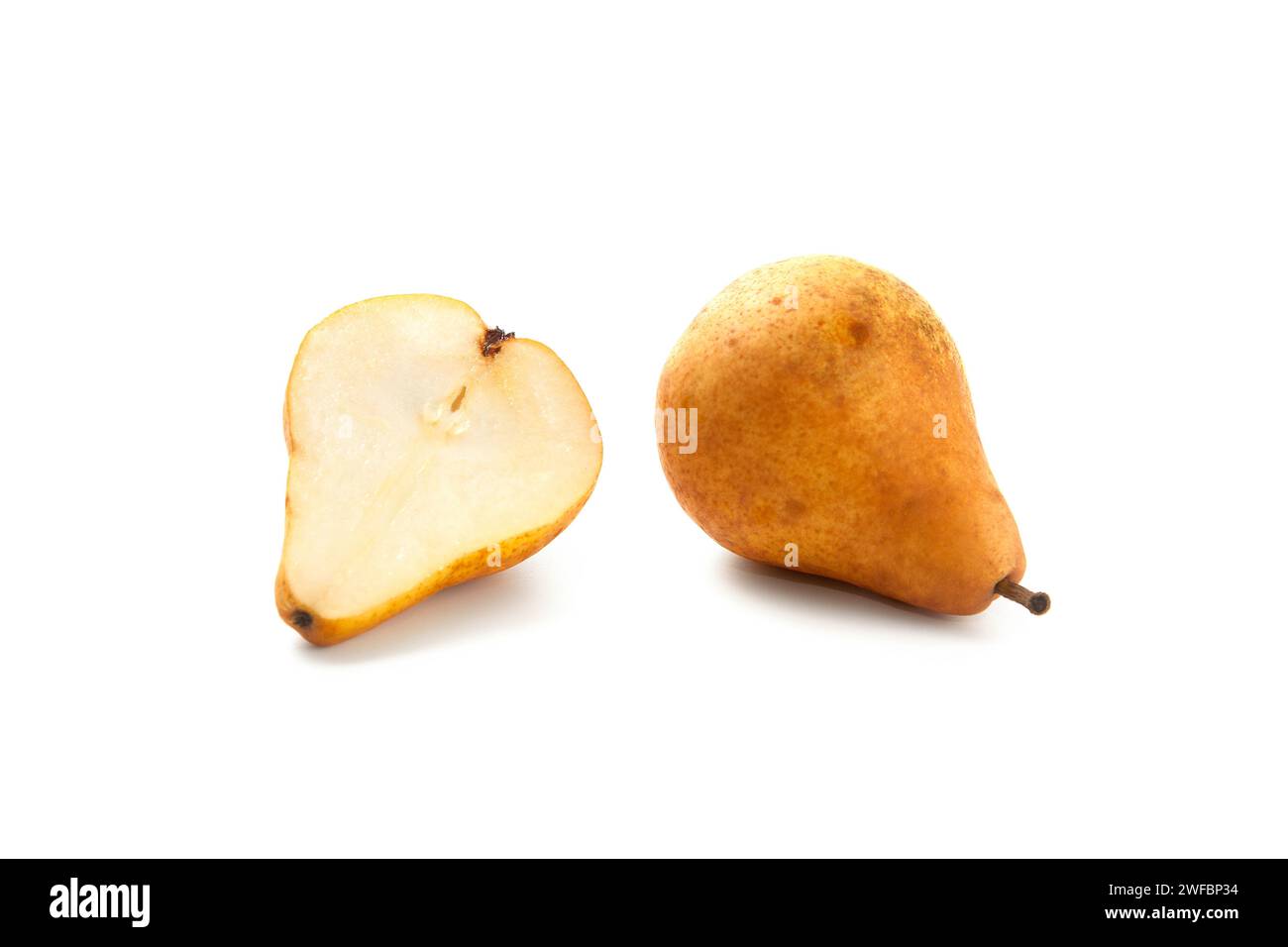 Whole and half of ripe juicy pear fruit with soft shadow isolated on ...