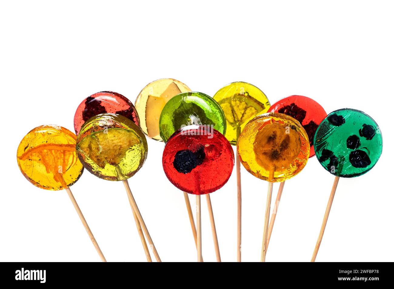 Lollipops with dry fruits inside on a white background. Healthy ...