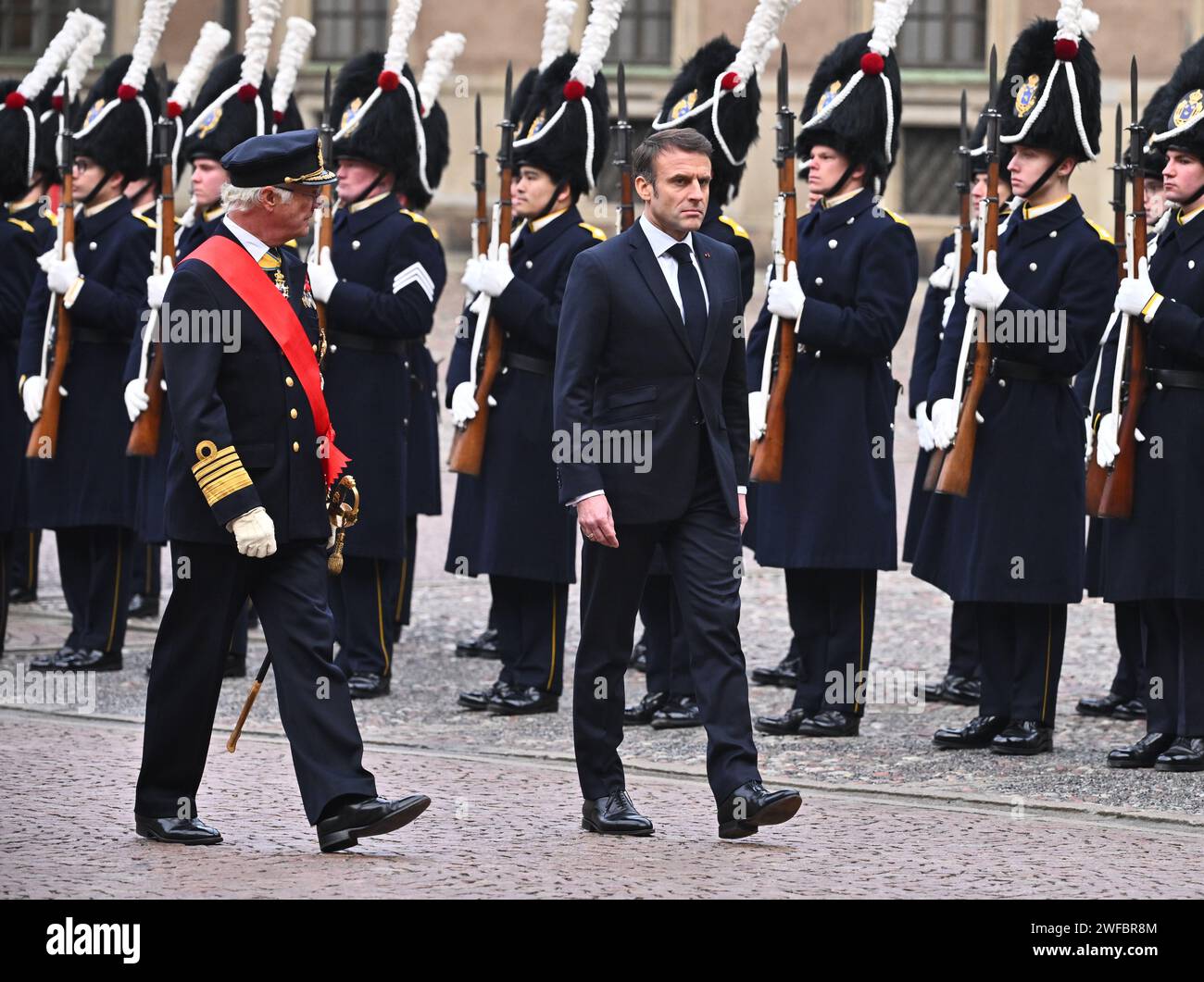 French President Emmanuel Macron and King Carl XVI Gustaf inspect the ...
