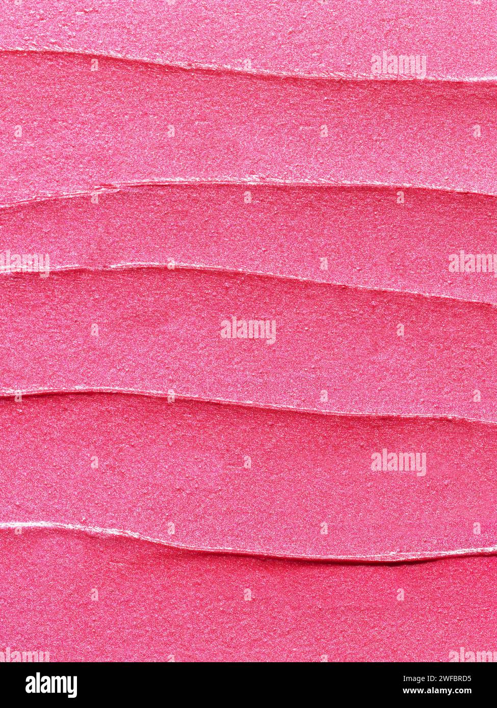 Pink shimmering glossy lipstick texture background. Cosmetic product ...