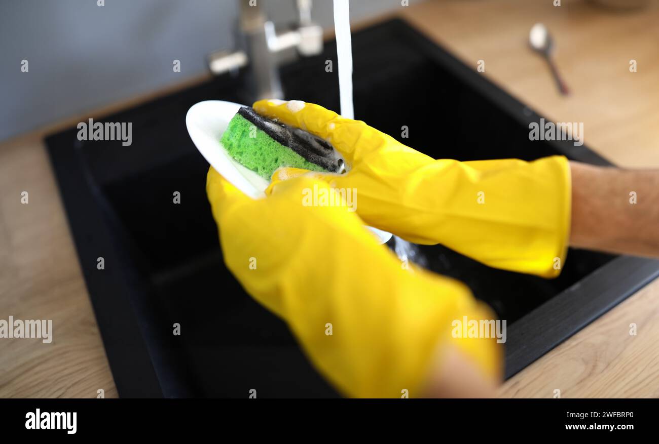 Person washing dirty dishes under hi-res stock photography and images ...