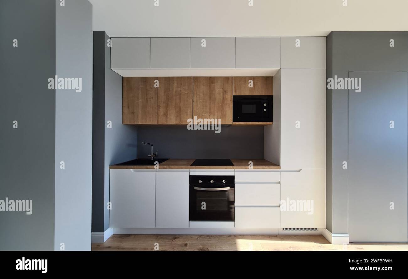 Installation built-in furniture and wiring kitchen Stock Photo - Alamy