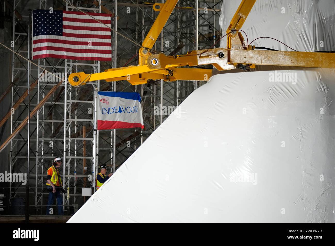 Space Shuttle Endeavour is lifted into the site of the future Samuel ...
