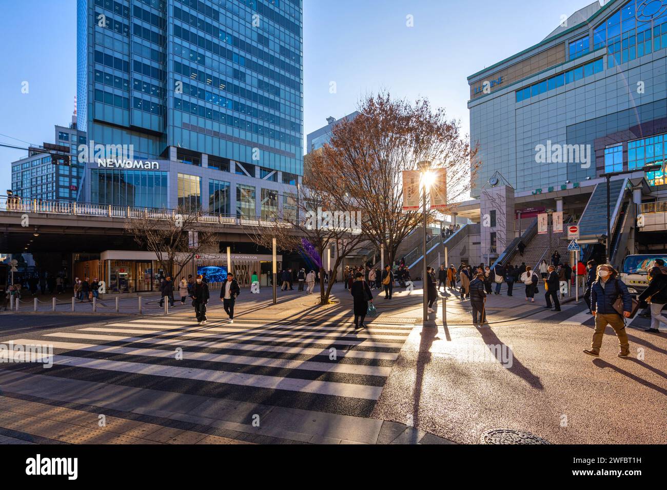 Tokyo, Japan. January 9, 2024. crowd of people on a sidewalk waiting to ...