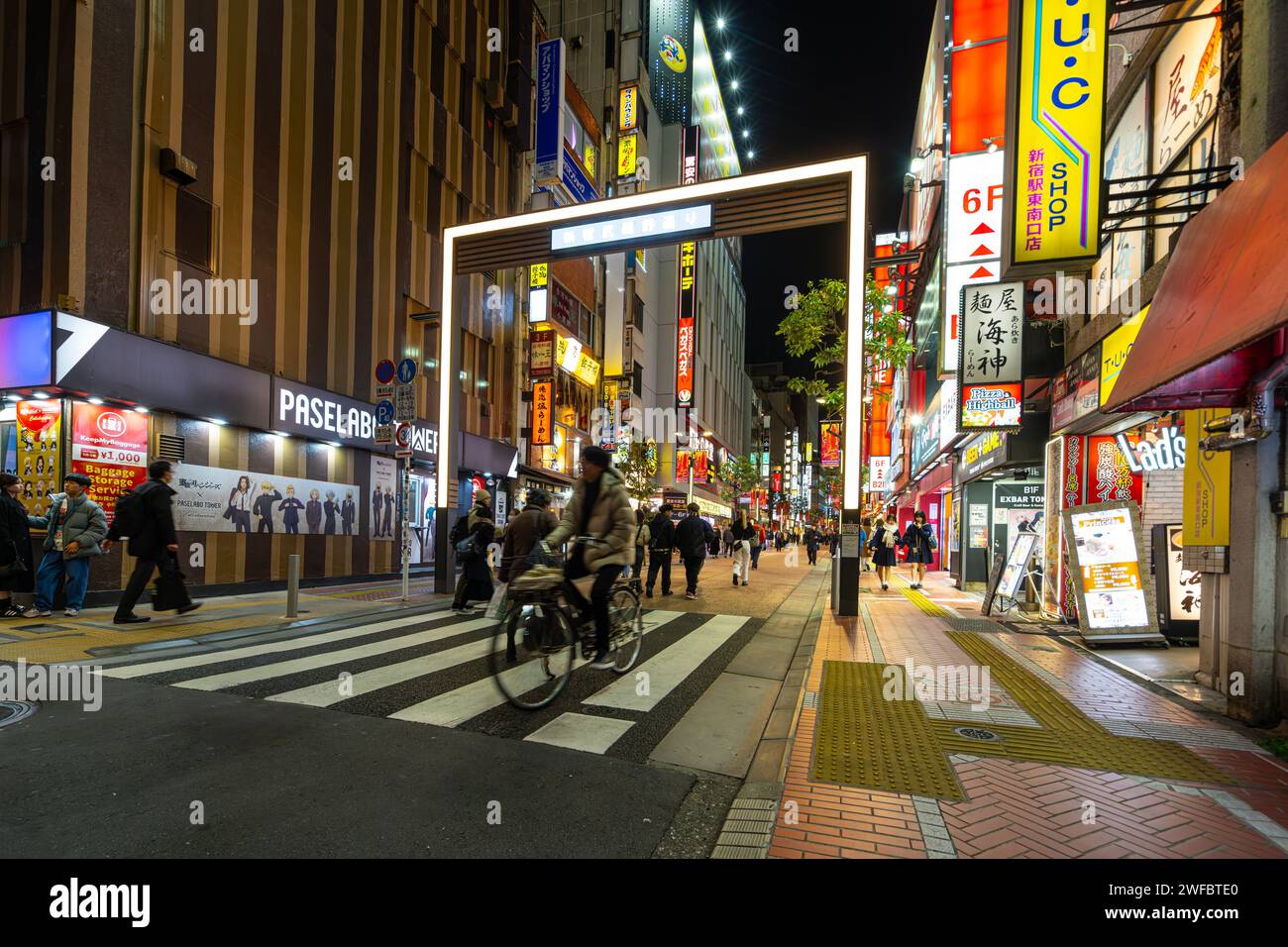Tokyo, Japan. January 9, 2024. night view of people walking among the ...