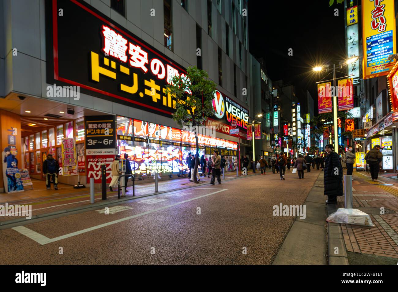 Tokyo, Japan. January 9, 2024. night view of people walking among the ...