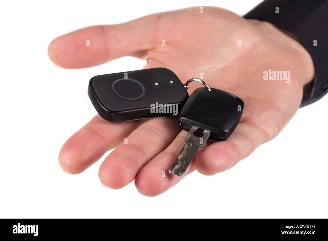 Car Keys. Seller hand giving keys on white Stock Photo - Alamy