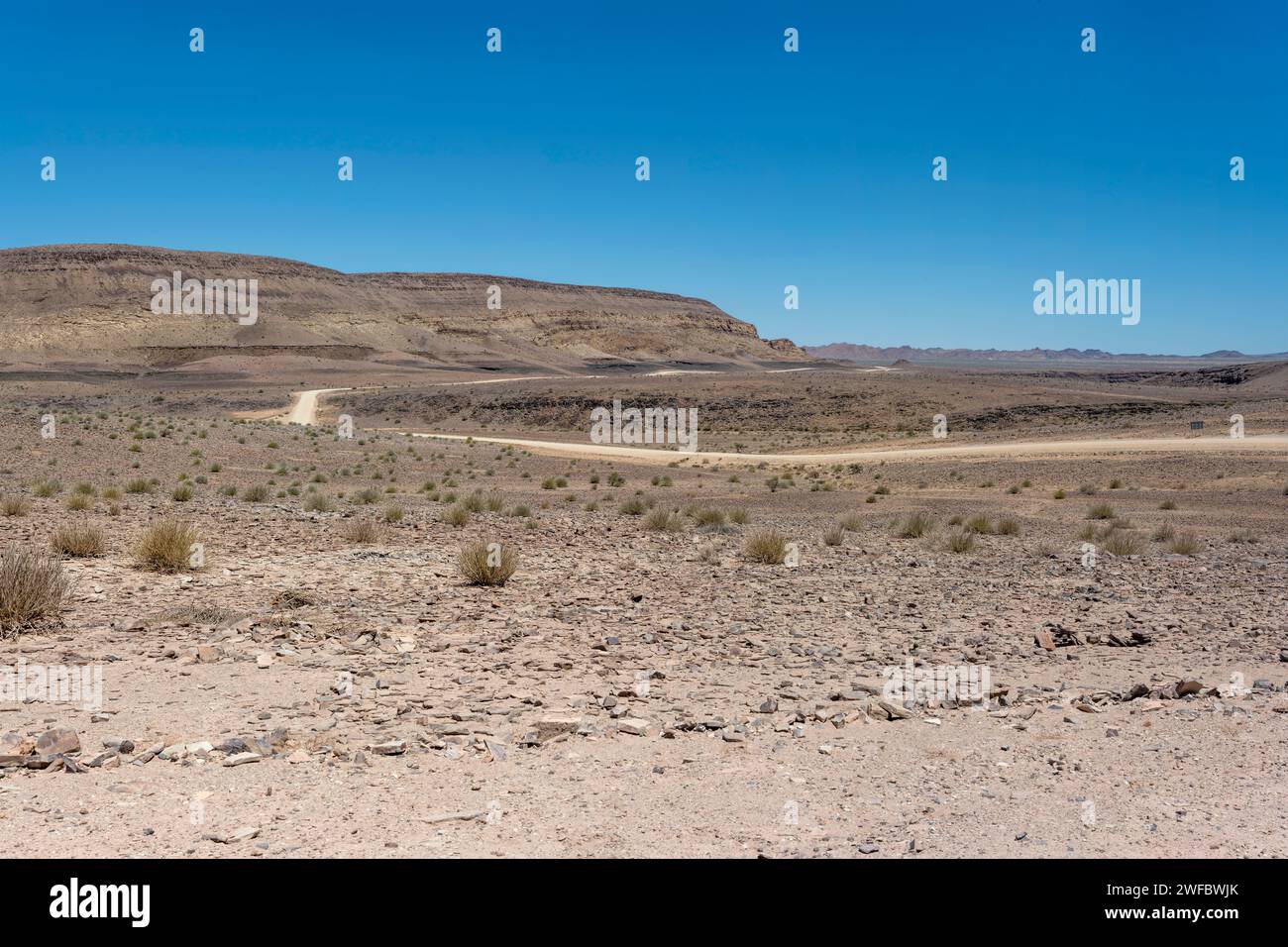 landscape with layers of conglomerate and basalt on hills and D324 ...