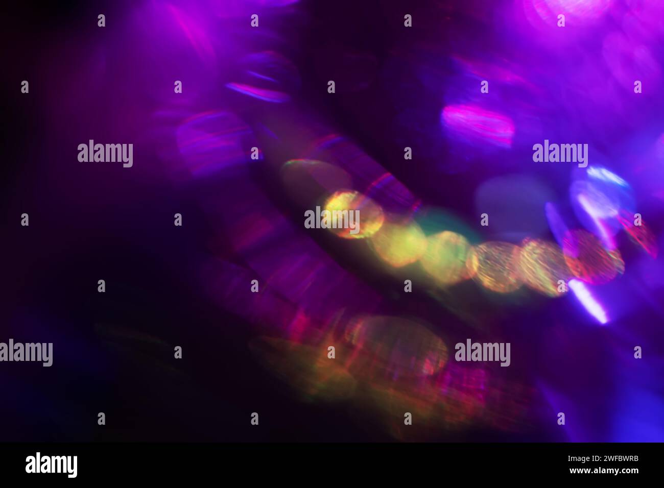 Abstract blurred colorful lens flare bokeh on black Stock Photo - Alamy