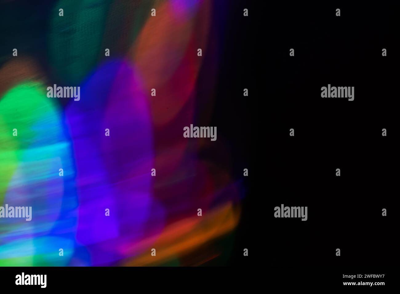 Abstract blurred colorful lens flare bokeh on black Stock Photo - Alamy