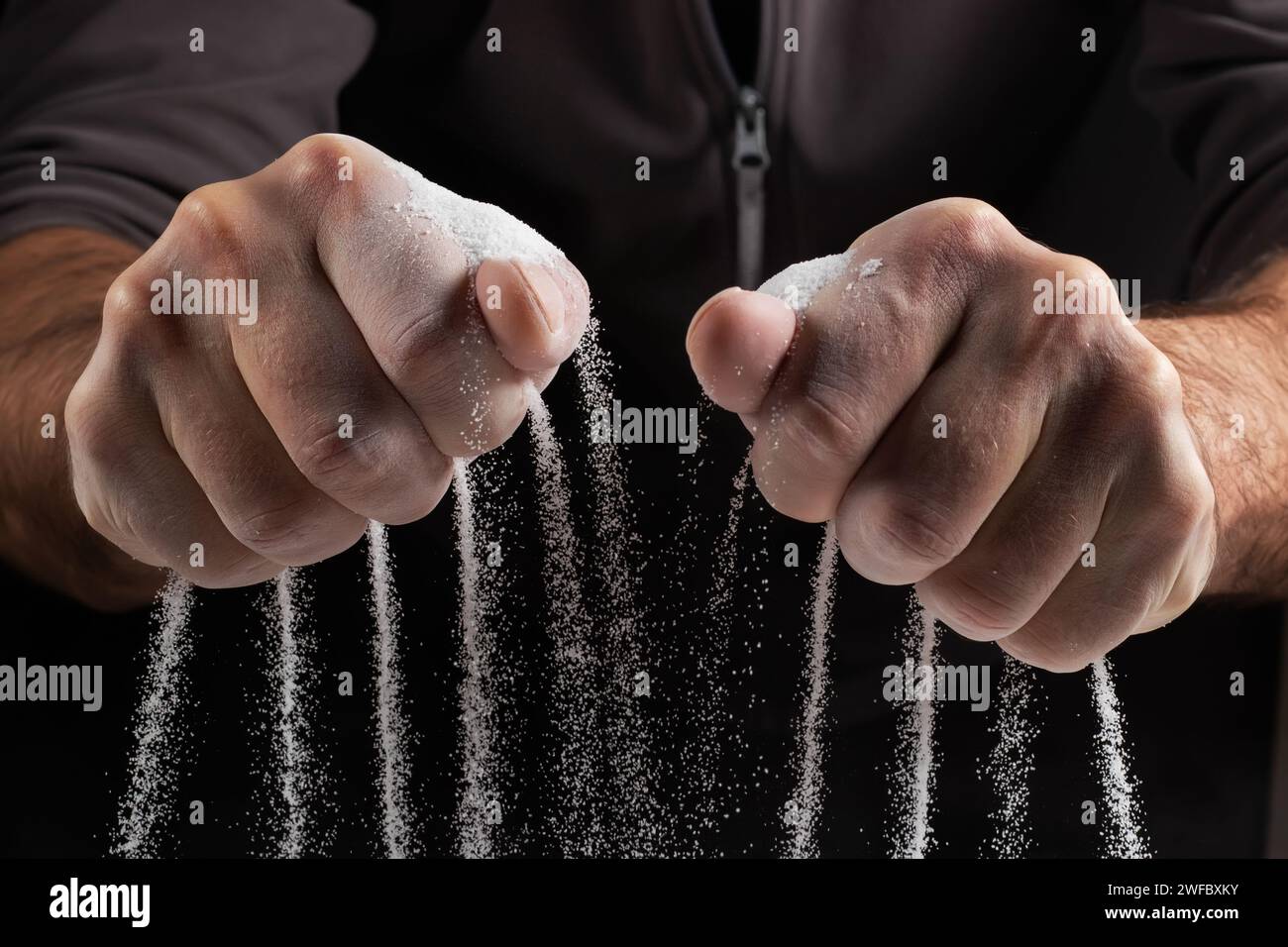 sand running through hands as a symbol for time running Stock Photo - Alamy