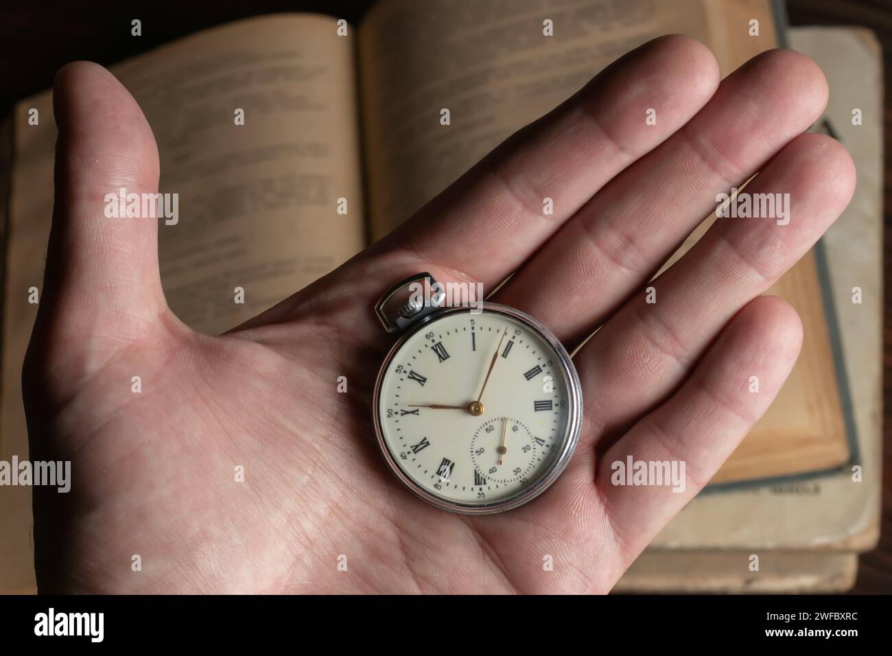 Man holding pocket watch hi-res stock photography and images - Alamy