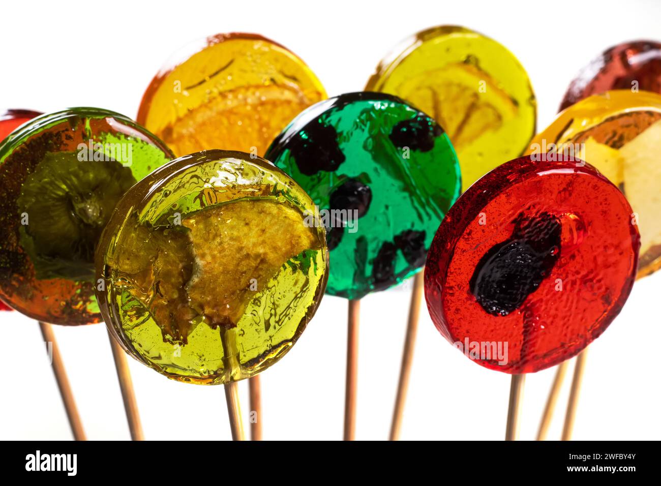 Lollipops with dry fruits inside on a white background. Healthy ...