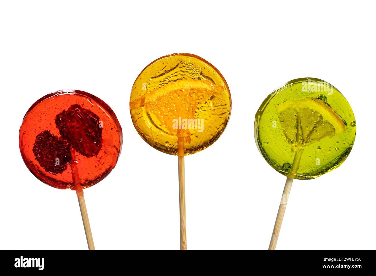 Sweet colorful lollipops with dried fruits on white background Stock ...