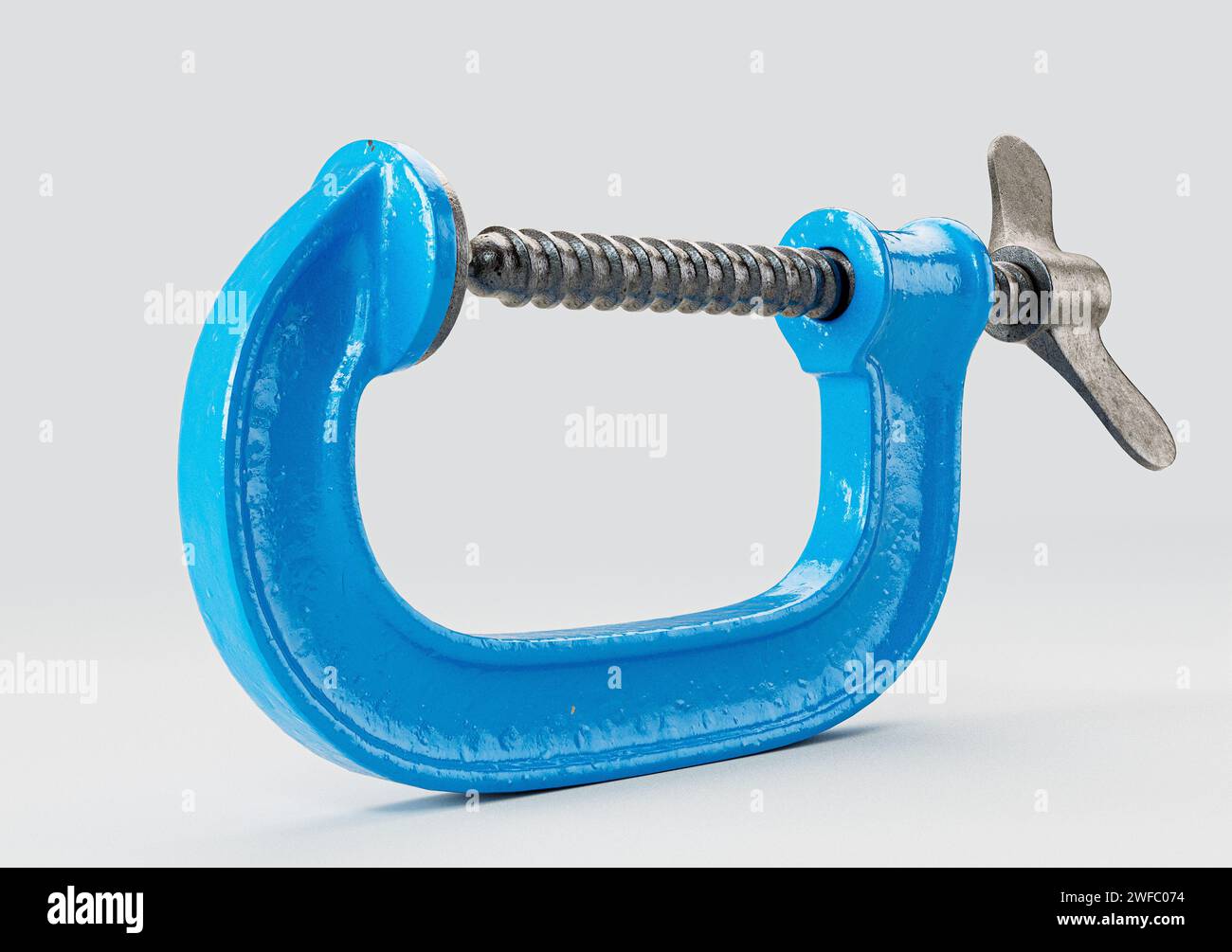 A blue vintage styled G-clamp tool on an isolated white studio ...