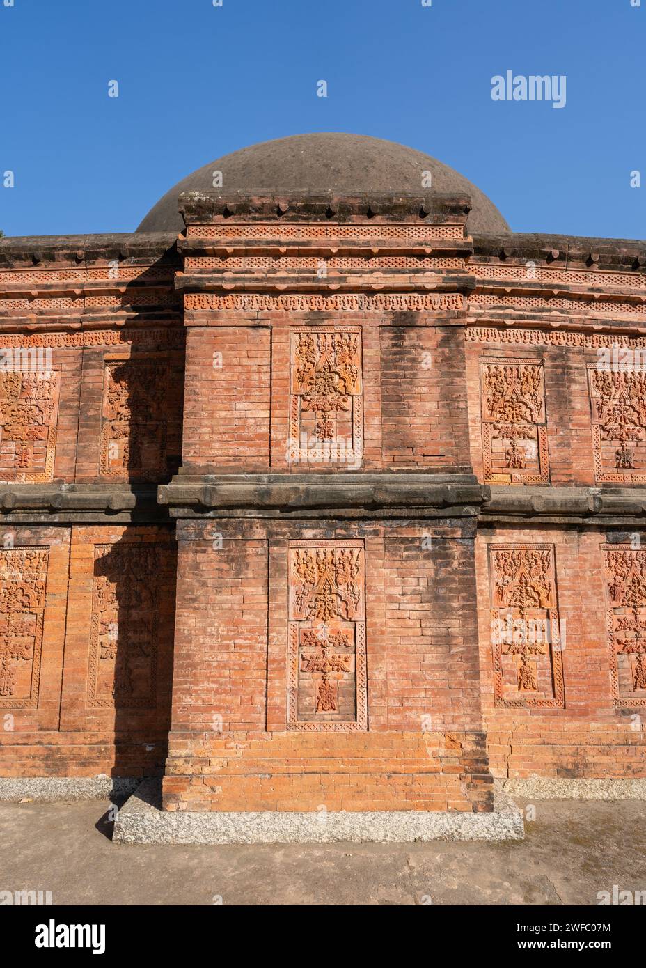 Vertical view of brick and terracotta decor on back wall of ancient ...