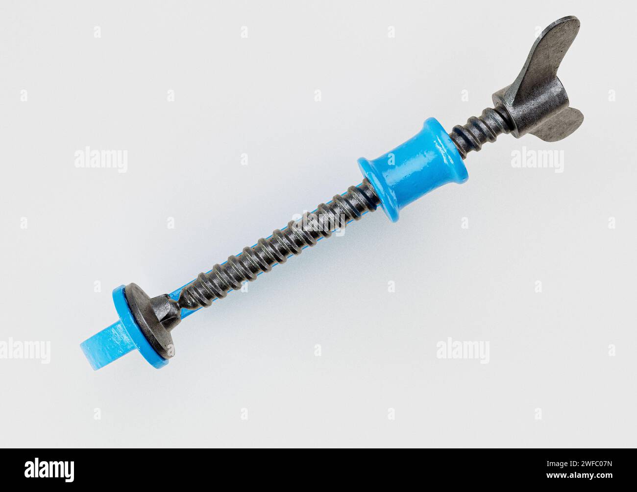 A blue vintage styled G-clamp tool on an isolated white studio ...