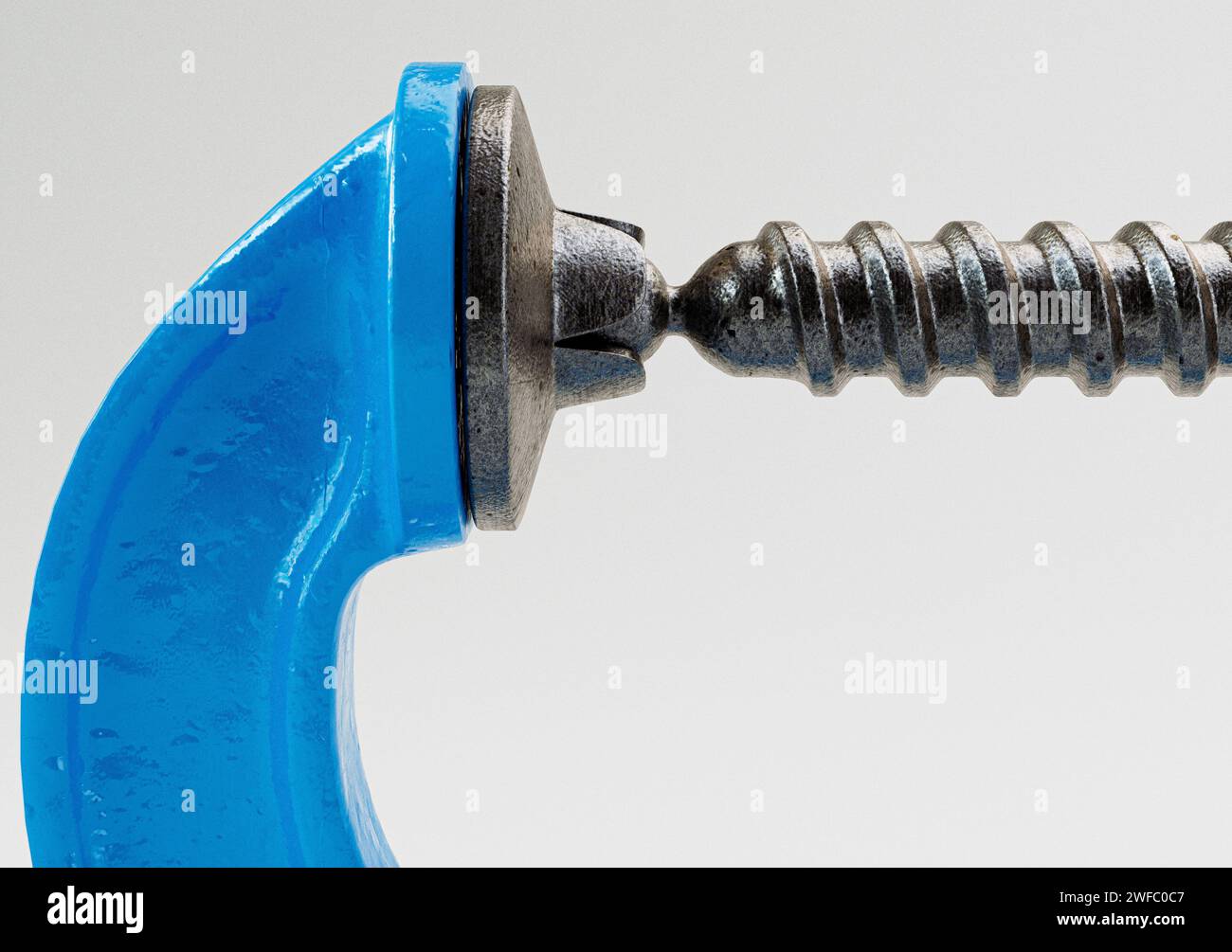 A blue vintage styled G-clamp tool on an isolated white studio ...