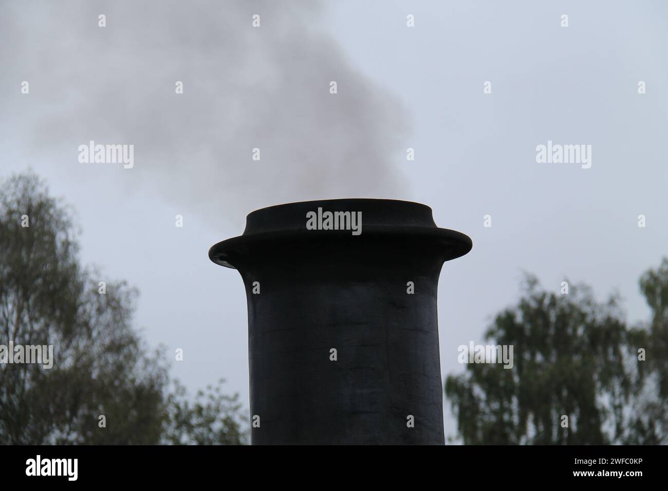 The Smoking Funnel of a Vintage Steam Railway Engine Stock Photo - Alamy