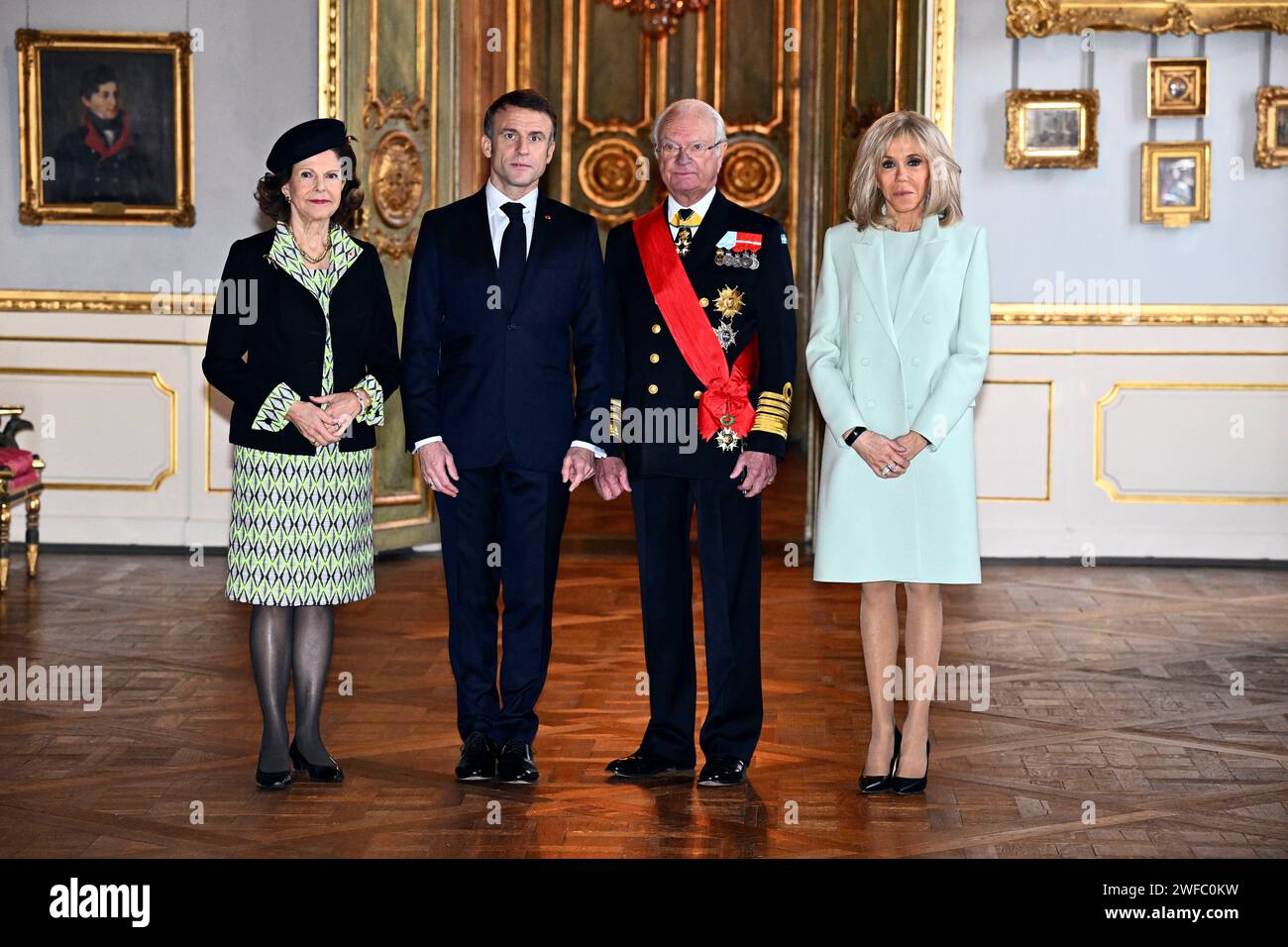 French President Emmanuel Macron, center left, and his wife Brigitte ...