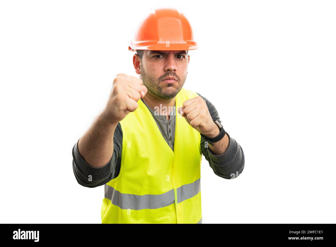 Angry male builder wearing work uniform orange safety hardhat and ...