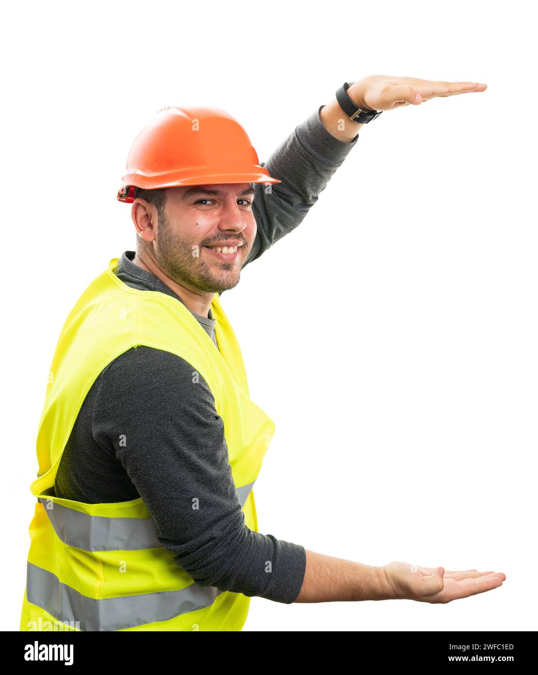 Happy builder man with trustworthy friendly expression presenting large ...