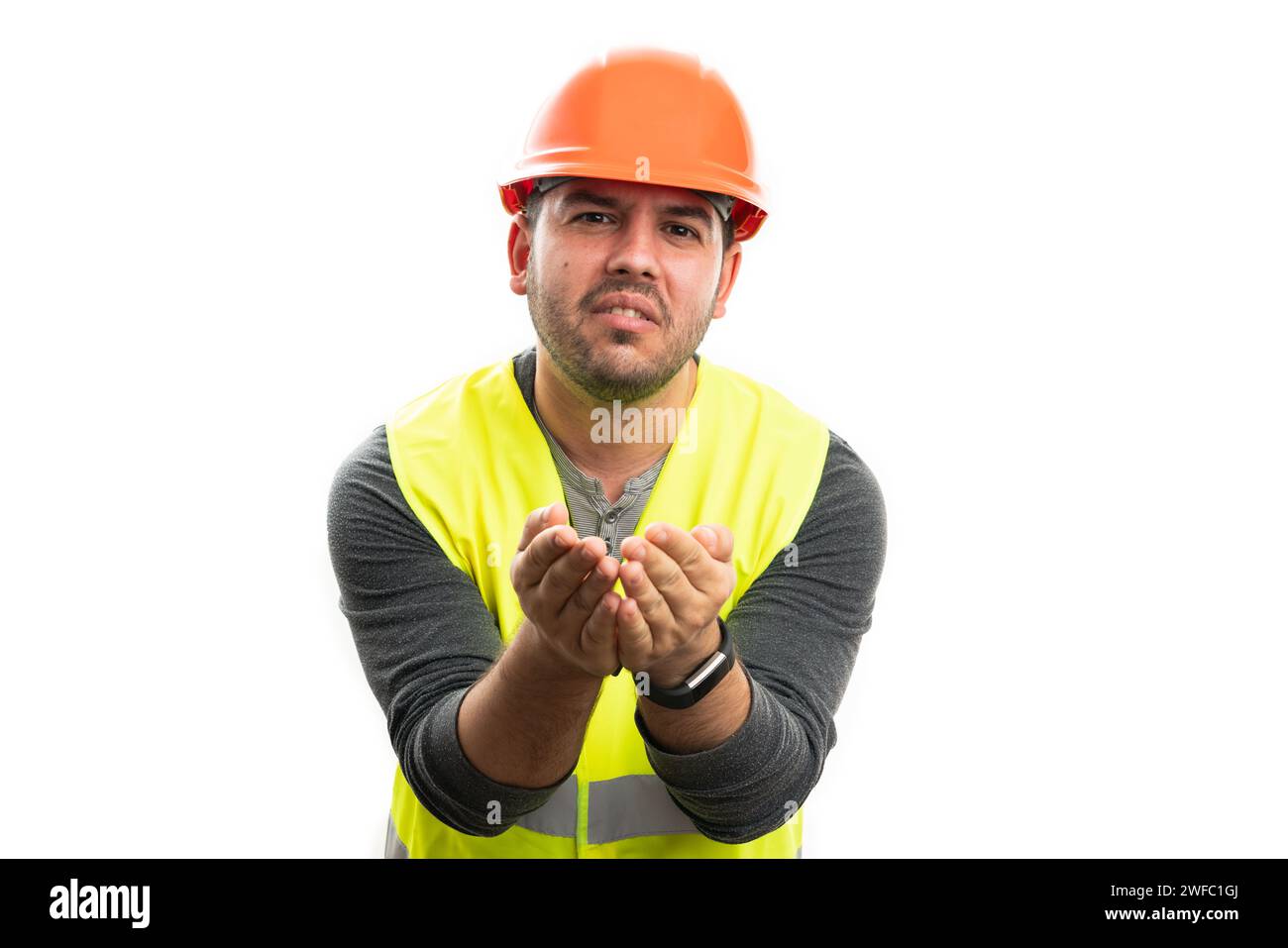 Poor sad builder with desperate expression begging for money making ...