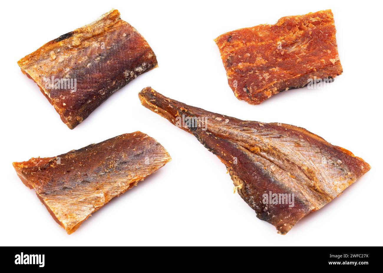 Pieces of cleaned dried fish isolated on white. Dry Peppered Pollack ...