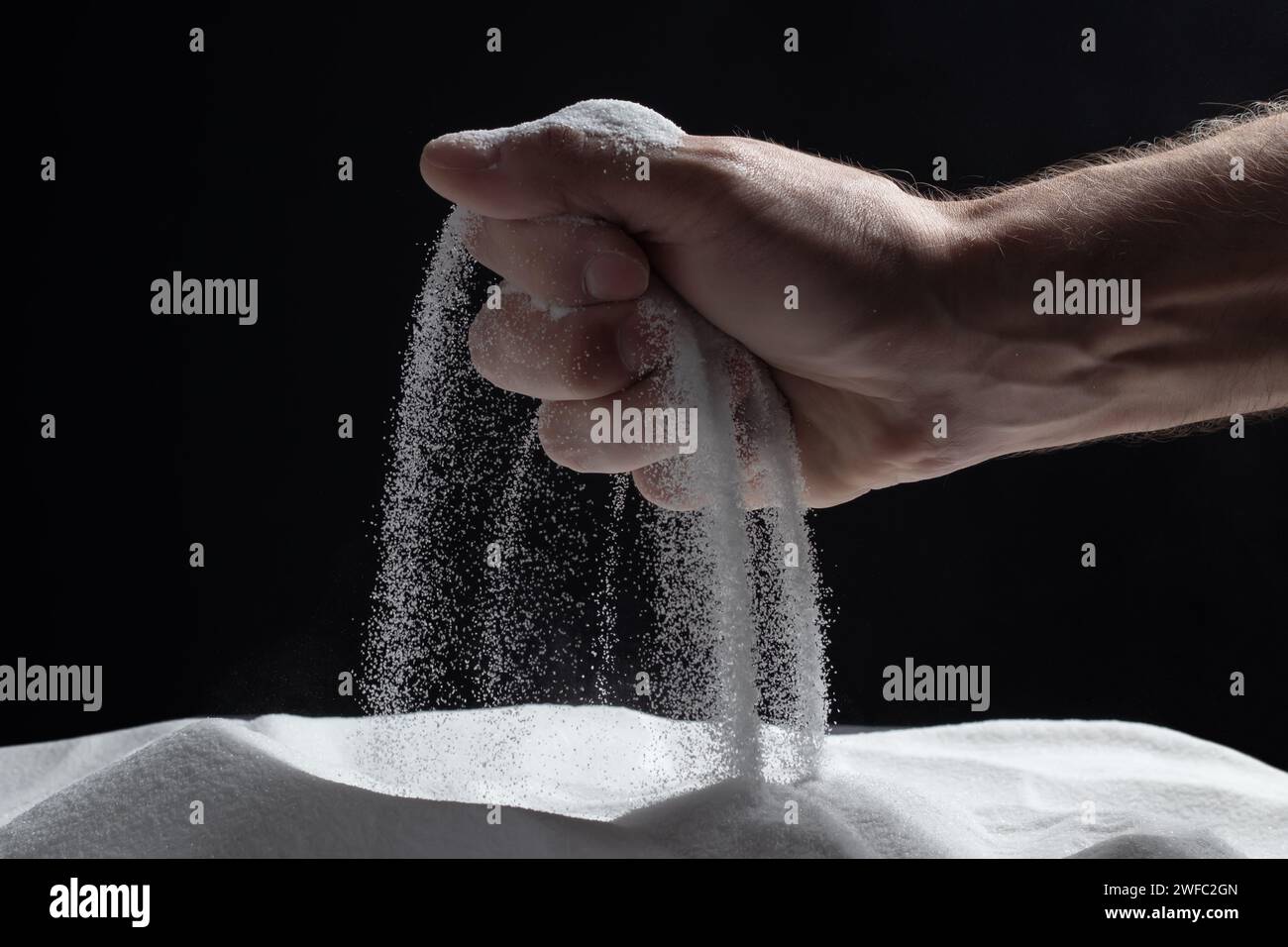 Sand running through hand symbol hi-res stock photography and images ...