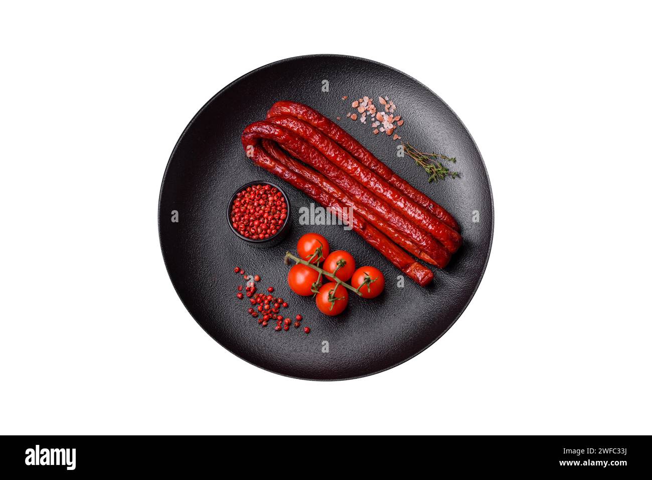 Delicious thin smoked hunting sausages with salt, spices and herbs on a ...