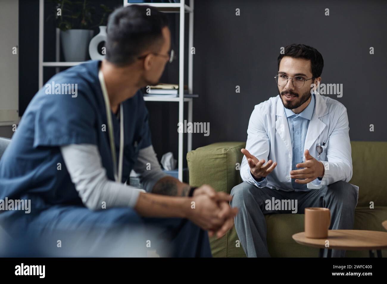 Male Doctors Talking during Work Break Stock Photo - Alamy