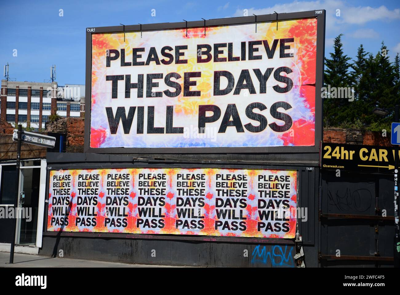 Please Believe These Days Will Pass poster on a billboard during the ...