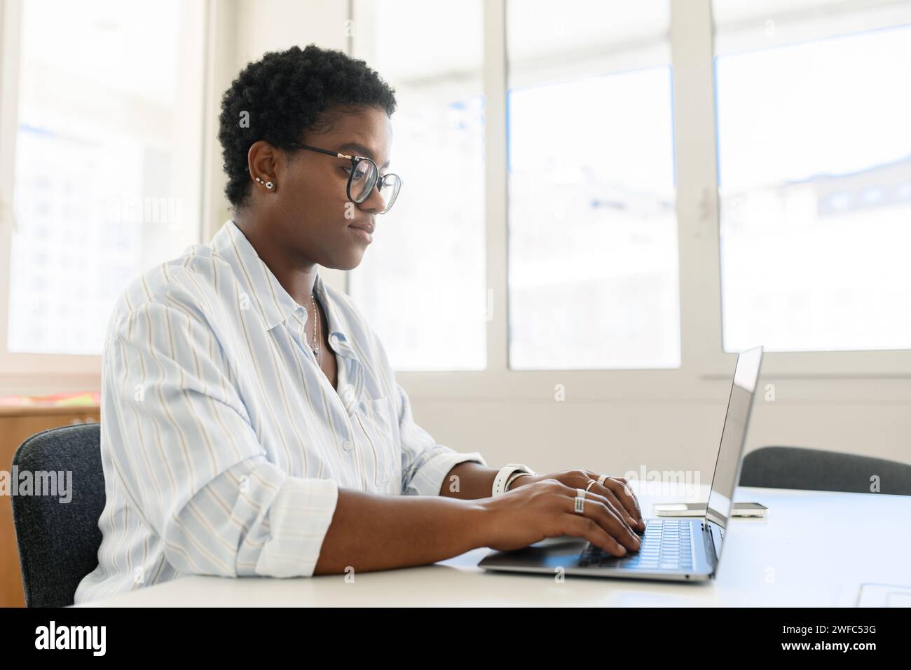 Confident serious young business woman, female freelancer, programmer ...