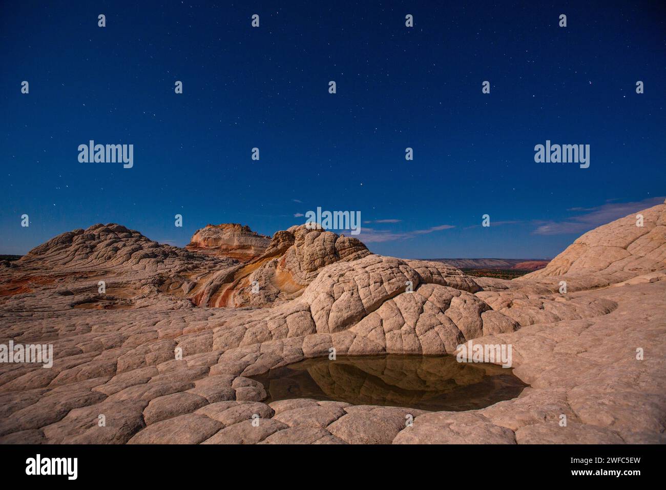 Stars over the moonlit sandstone in the White Pocket Recreation Area ...