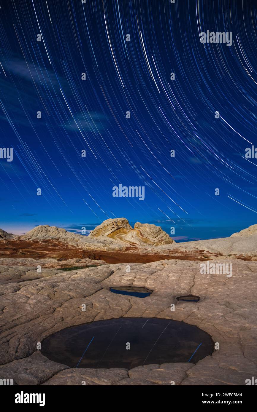 Star trails over the moonlit sandstone in the White Pocket Recreation ...