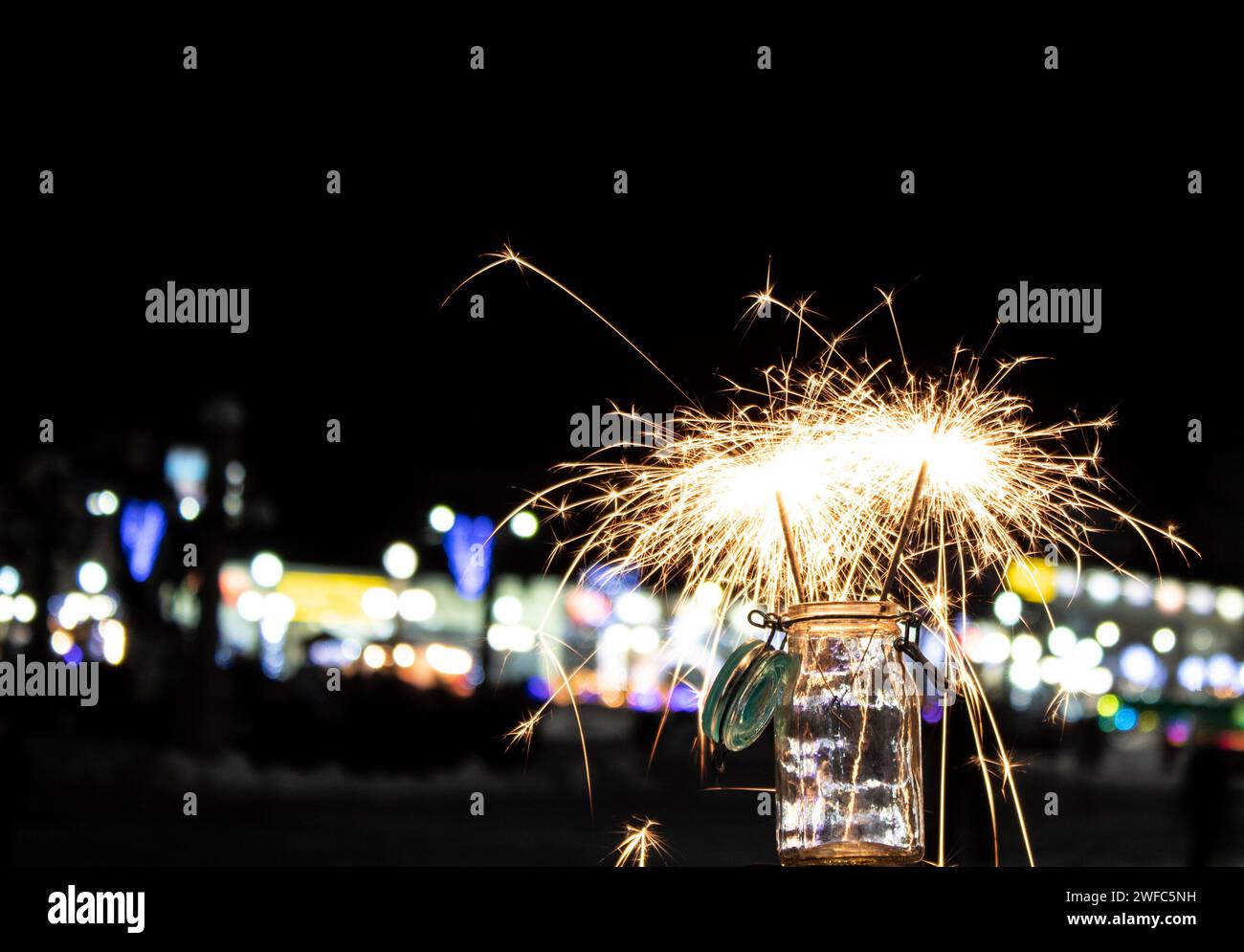 Flames of Bengal fire on the streets of the night city Stock Photo - Alamy