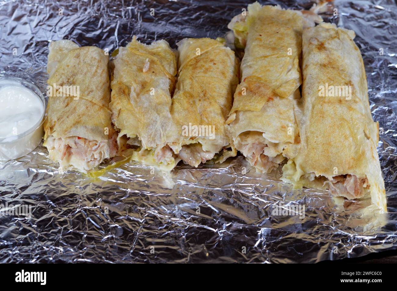 Syrian recipe cuisine background, chicken shawerma or shawarma tortilla ...