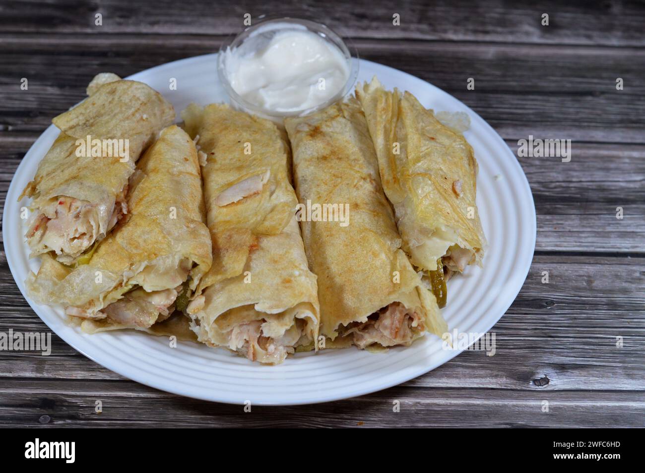 Syrian recipe cuisine background, chicken shawerma or shawarma tortilla ...