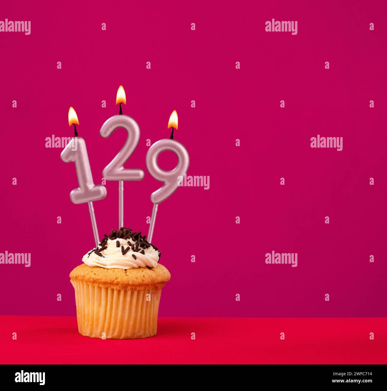 Birthday cupcake with candle number 129 - Rhodamine Red foamy ...